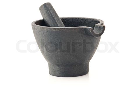 Gusseisen- Mörser mit Stößel auf weißem | Stock Bild | Colourbox