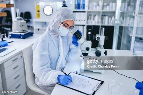Scientist Looking Down Microscope Photos And Premium High Res Pictures
