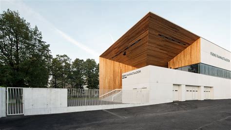 Angled Surfaces Lend Dynamic Aesthetic To Kamp Arhitektids Timber And Concrete Sports Stadium