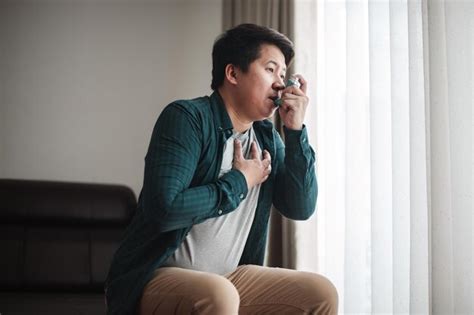 Premium Photo Panoramic Shot Of Asthmatic Man Using Inhaler With