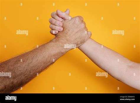 Crop Anonymous Aged And Young People Touching Each Others Hands On