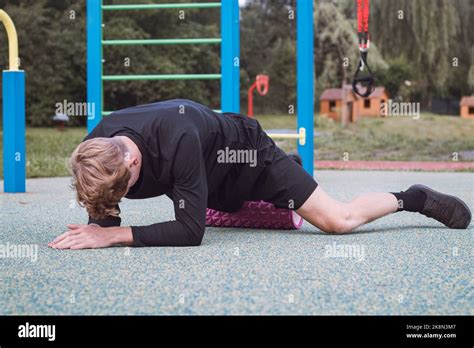 Fitness Trainer Exercises And Warms Up The Lower Part Of The Body With