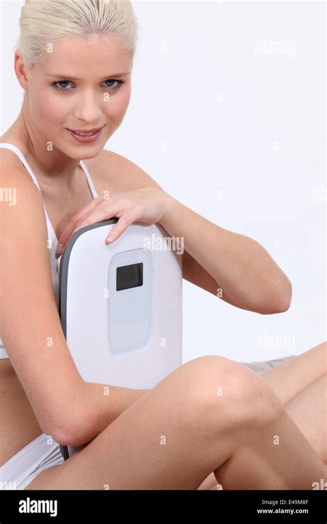 Woman Holding A Scale Stock Photo Alamy
