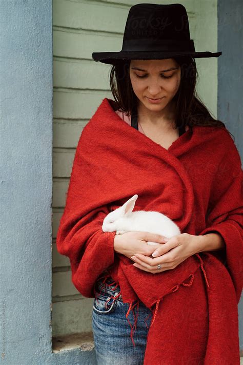 Young Woman Holds Tiny White Rabbit By Stocksy Contributor Artem