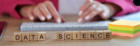 Words Data Science On Wooden Cubes And Female Scientist Working With