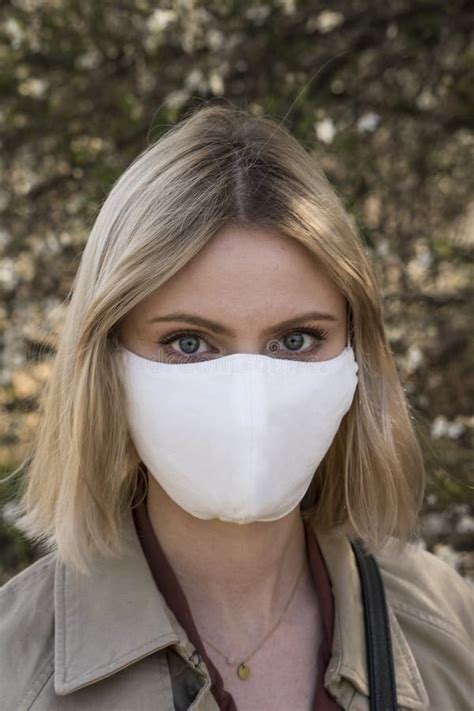 Young Blonde Girl In A Protective Mask For Spreading Of Disease Virus Sars Cov 2 Epidemic