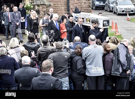 The Visage Decorated And Hat Topped Coffin Of Steve Strange Is Brought Out From From All Saints