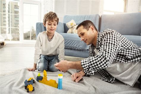 Cheerful Daddy And Son Playing Together Stock Photo Image Of Love Nurture