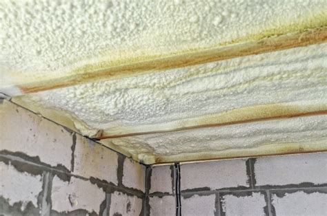 Insulation Of The Ceiling In House With Polyurethane Foam Insulating Foam Between Wooden Beams