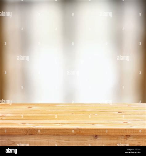 Empty Wooden Table And De Focused Window Light Background Filtered
