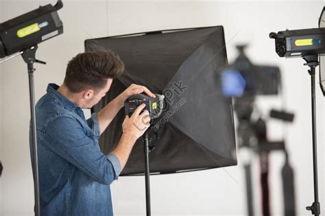 Setting Timer On Light Box In Studio By Photographer Picture And HD