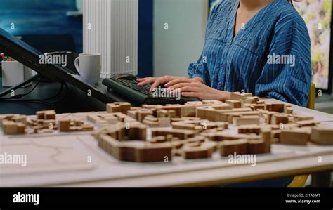 Close Up Of Architectural Desk With Building Model And Touch Screen