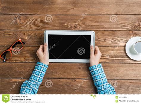 Top View Of Woman Sitting At Wooden Table And Working With Tablet Stock Photo Image Of Tablet