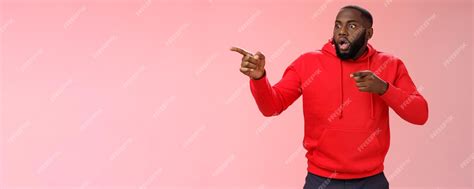 Premium Photo Shocked Stunned Man Widen Eyes Gasping Drop Jaw Standing Stupor Pointing Look