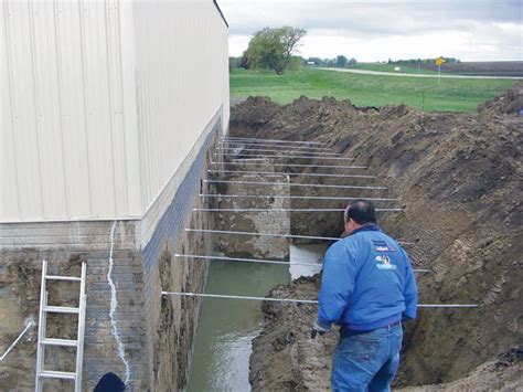 Repairing Straightening Tilting Foundation Walls By Trusted Foundation Repair Contractors In