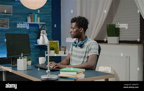 Programmer Using Software With Data Codes For Firewall Security On Computer Man Working As