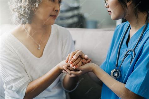 Premium Photo Doctors Hand Reassuring Elderly Patient