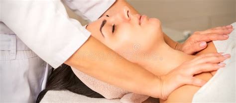 Young Caucasian Woman With Closed Eyes Getting A Chest Massage In A