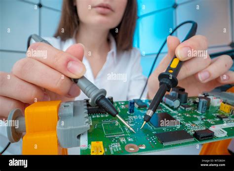 Girl With Measuring Devices In The Electronics Laboratory Stock Photo Alamy