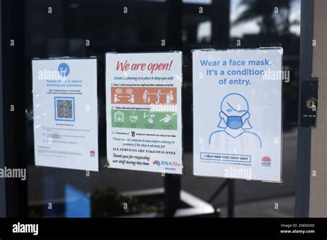Australian Covid Signage With QR Code And Sign Requesting That Face Masks Be Worn Inside The