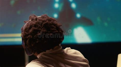 Man Plays Sf Game With Overlay Hud Showing Health Bars And Minimap On