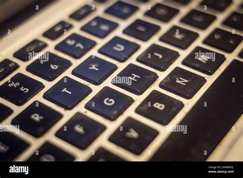 Picture Of Arrows Of A Dirty Keyboard With Black Keys That Would Need Some Cleaning Stock Photo