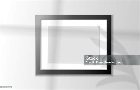 벽에 모형 검은 프레임 사진입니다 액자에 넣은 삽화 그림을 조롱합니다 그림자가 있는 수평 테두리 그림자가 있는 수평 테두리 빈 A4 사진 프레임 현대적이고 세련된 3d