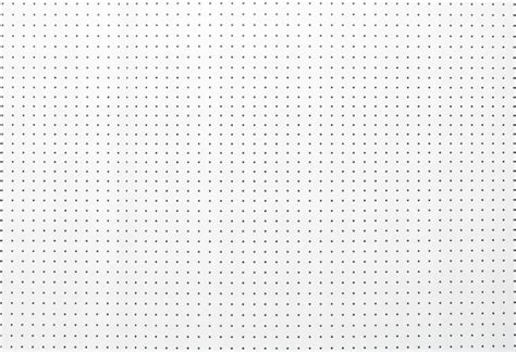 A White Background With Evenly Spaced Dots Forming An A4 Paper Grid