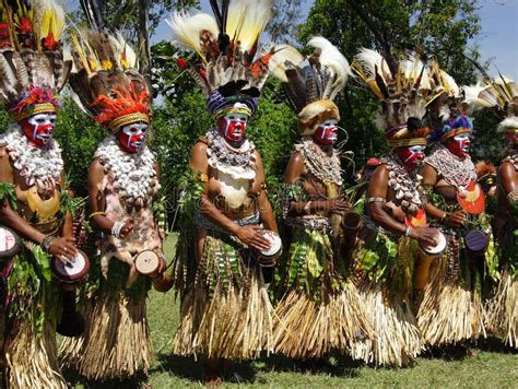 Dancing Papuans In Papua New Guinea On A Traditional Holiday In Mount Hagen In National Clothes