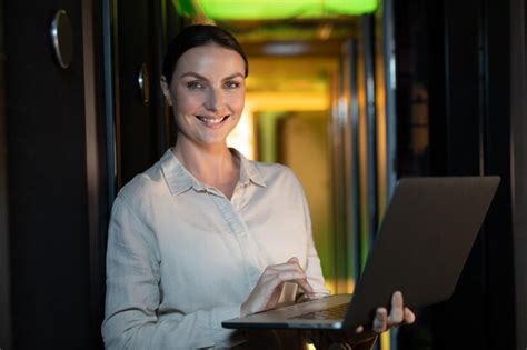 Premium Photo Portrait Of Caucasian Female Engineer Smiling While Using Laptop In Computer