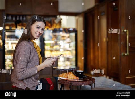 Girl Scrolling In Smartphone Stock Photo Alamy