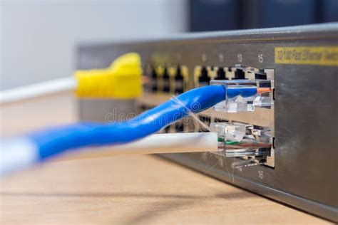 LAN Cable With RJ Connector Plugged Into Fast Ethernet Interface Port Of Switch Stock Image