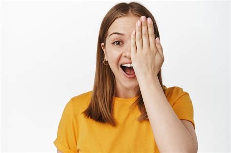 Free Photo Portrait Of Happy Young Woman Cover Half Of Face Laughing