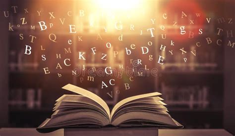 open book on the table and english alphabet floating above the book