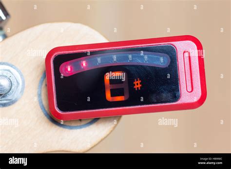 Series Of Tuning A Guitar C Out Of Tuning By A Digital Tuner Stock