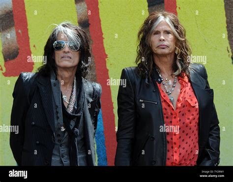 Guitarist Joe Perry L And Steve Tyler Lead Singer In The Rock Band