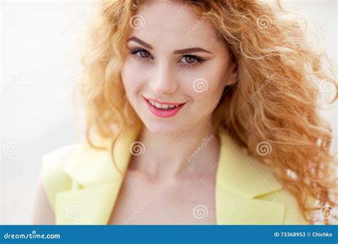 Close Up Portrait Of Seductive Redhead Girl With Red Lips In A Yellow Jacket Stock Image