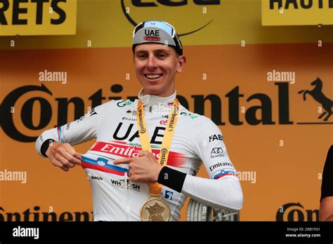 Tadej Pogacar Slovenia Uae Team Emirates National Champion Shows His Flag On Podium Tour De