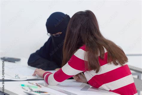 Two Multireligion Female University Architecture Babes Working On Practice Lessons Looking