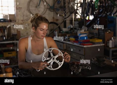 Female Mechanic Holding Crankset And Crank Arm Stock Photo Alamy