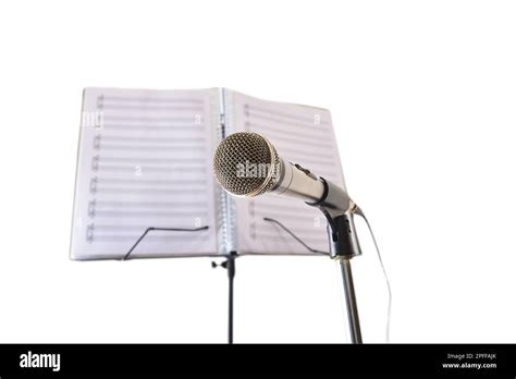 Microphone And Music Stand With Folder With Sheet Music Behind Isolated