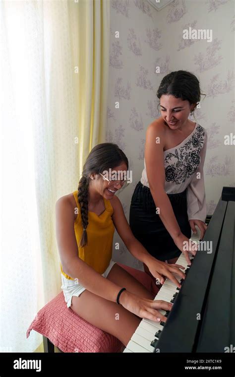 Piano Lesson With Teacher Instructing Babe Stock Photo Alamy