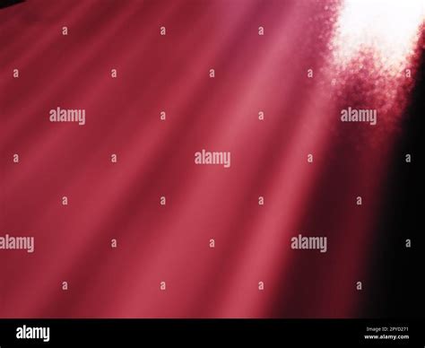 Diagonal Rays Of Light On A Red Pink Or Burgundy Background Blurred