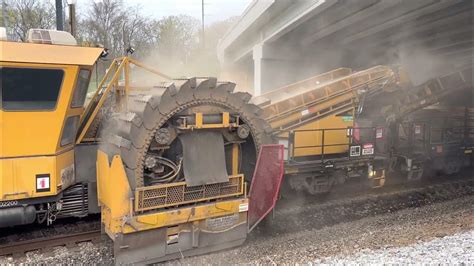 Loram Ballast Cleaner Passing Under A Bridge Youtube