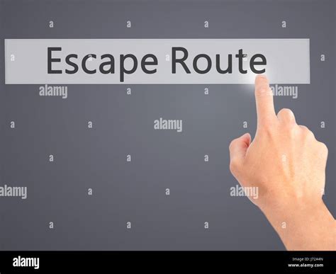 Escape Route Hand Pressing A Button On Blurred Background Concept