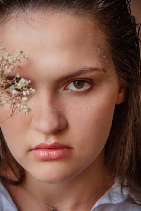 Elegant Portrait Of A Woman With Floral Detail And Glitter Makeup Caucasian Woman With Glitter