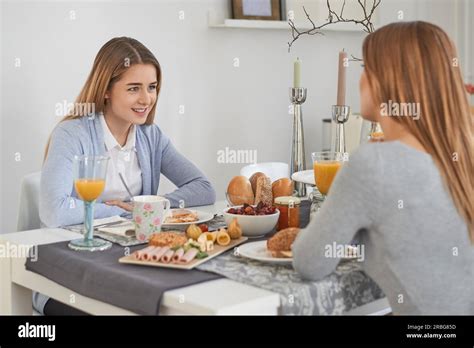 Mother And Daughter Having An Intimate Conversation Over Lunch Offering