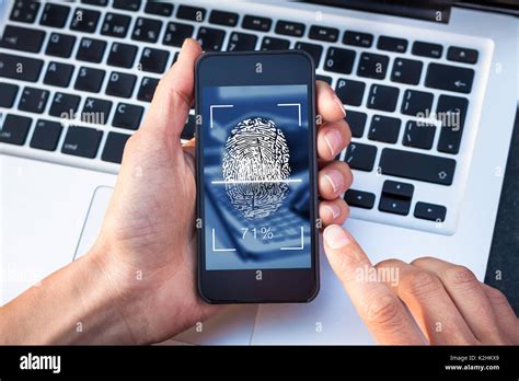 Fingerprint Scanning On Smartphone Screen With Finger Touching Biometric Digital Scanner
