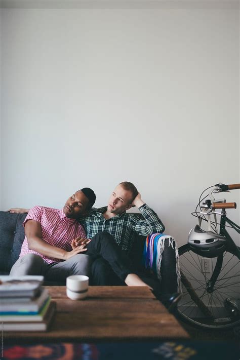 Portrait Of Young Interracial Gay Couple On A Couch By Stocksy