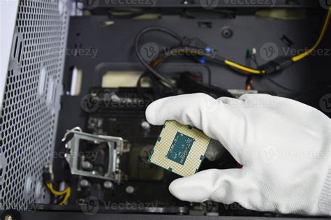 Image Of A Technician Inserting A CPU Chip Onto A Computer Motherboard Stock Photo At